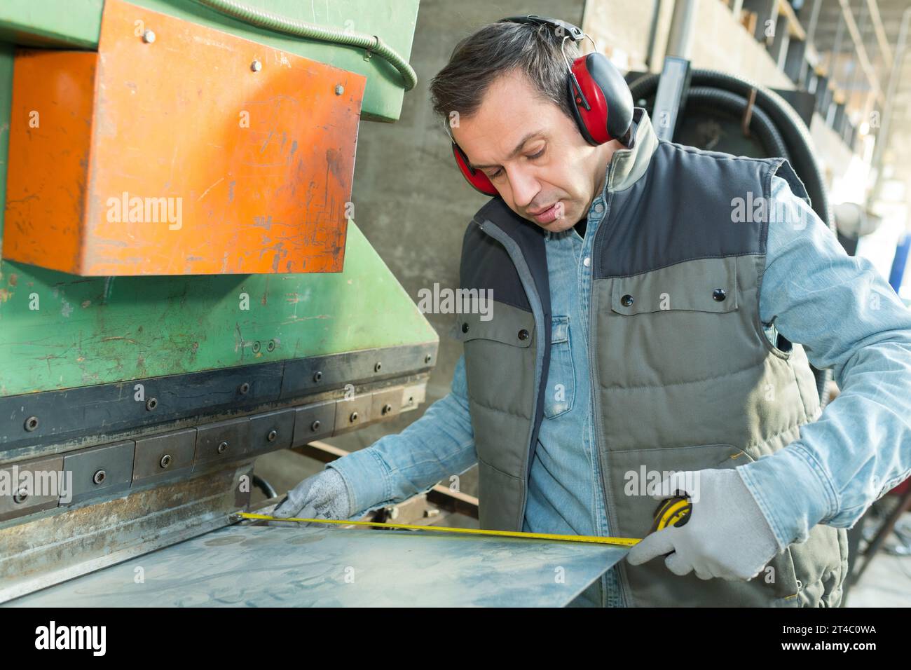 factory man worker operating at workshop Stock Photo - Alamy