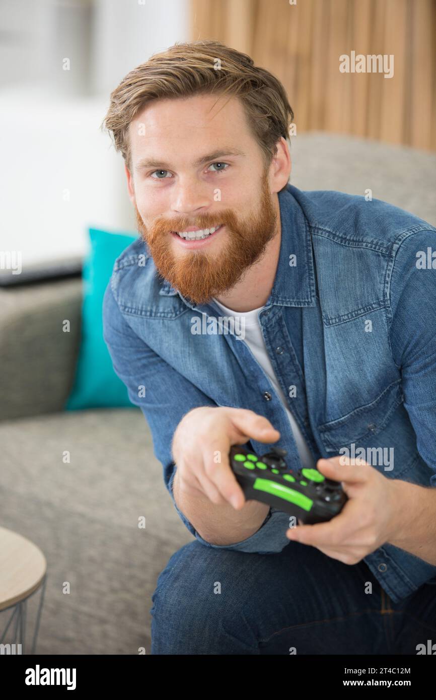 man happy playing video games Stock Photo - Alamy
