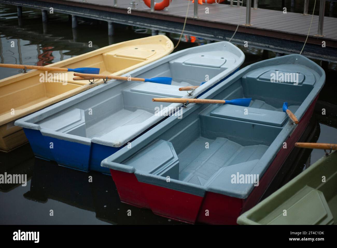 Boats on the dock. Swimming facility. Lots of empty boats. Boat station ...