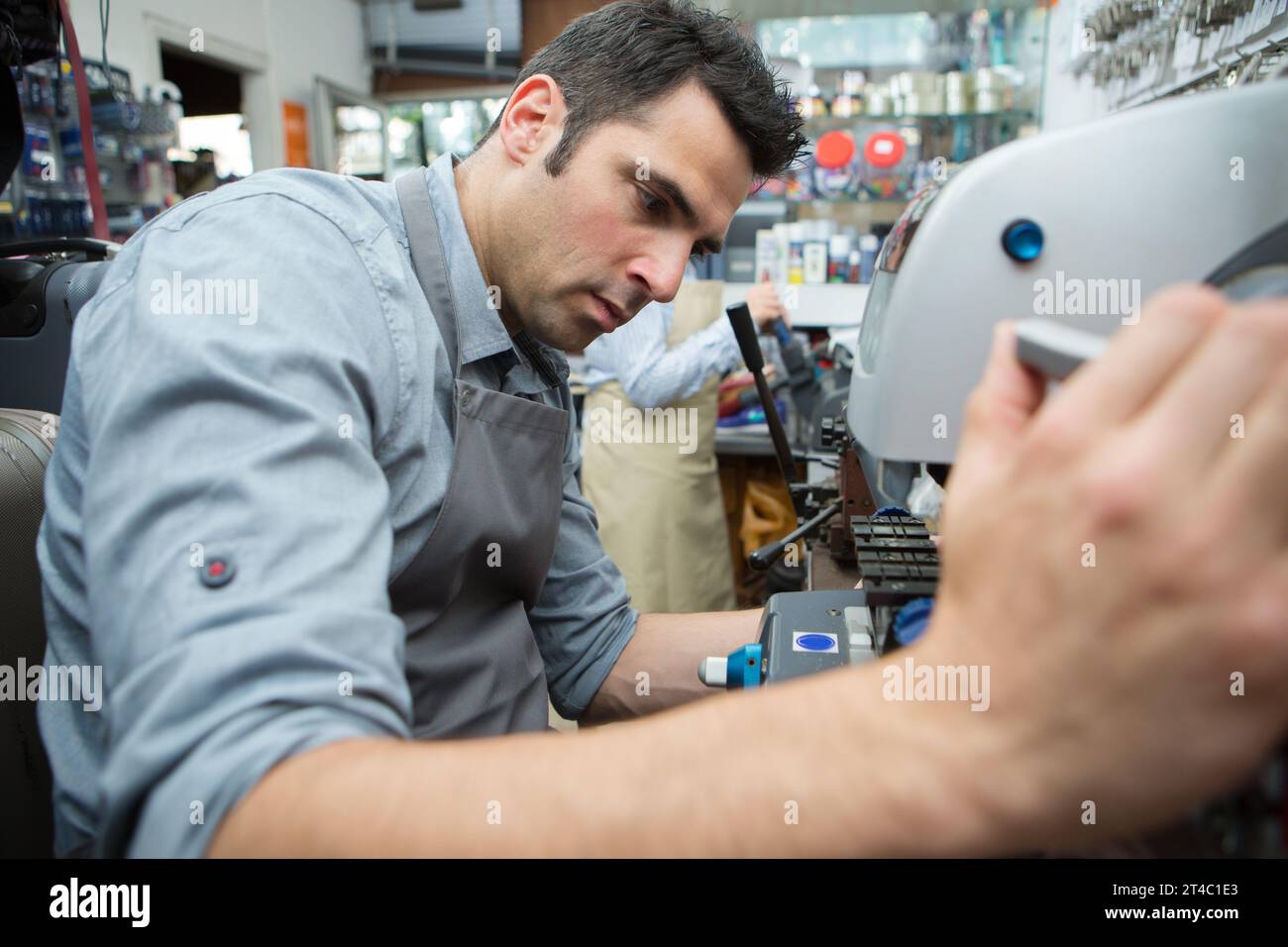 man making keys in a machine Stock Photo - Alamy