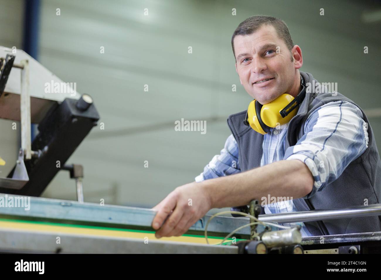portrait of male engineer with cad drawings in factory Stock Photo - Alamy