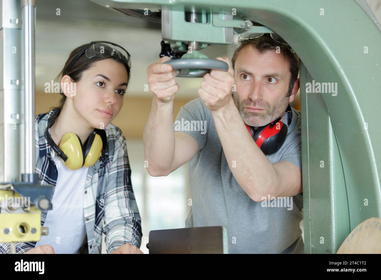 factory worker signing document in industrial hall Stock Photo - Alamy