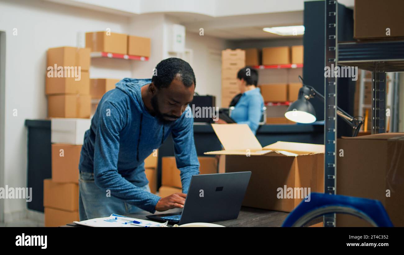Male entrepreneur taking supplies from hi-res stock photography and ...