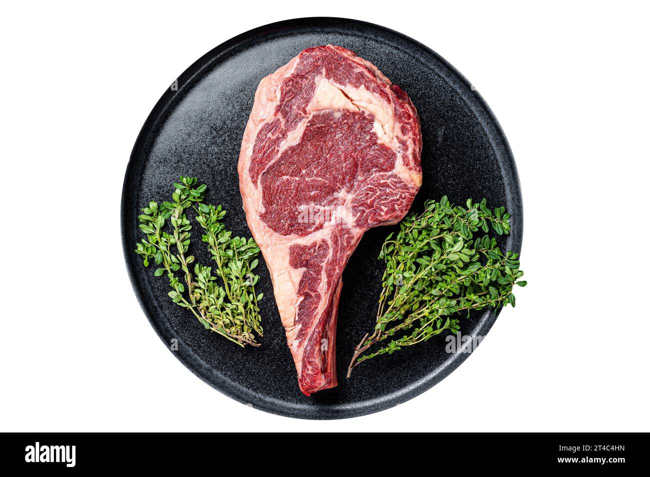 Dry aged cowboy or rib eye steak, raw beef meat with herbs. Isolated on ...