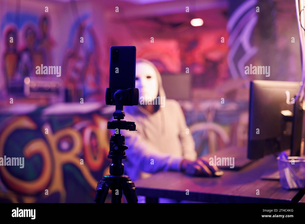 Anonymous criminal recording scam on smartphone camera in abandoned ...