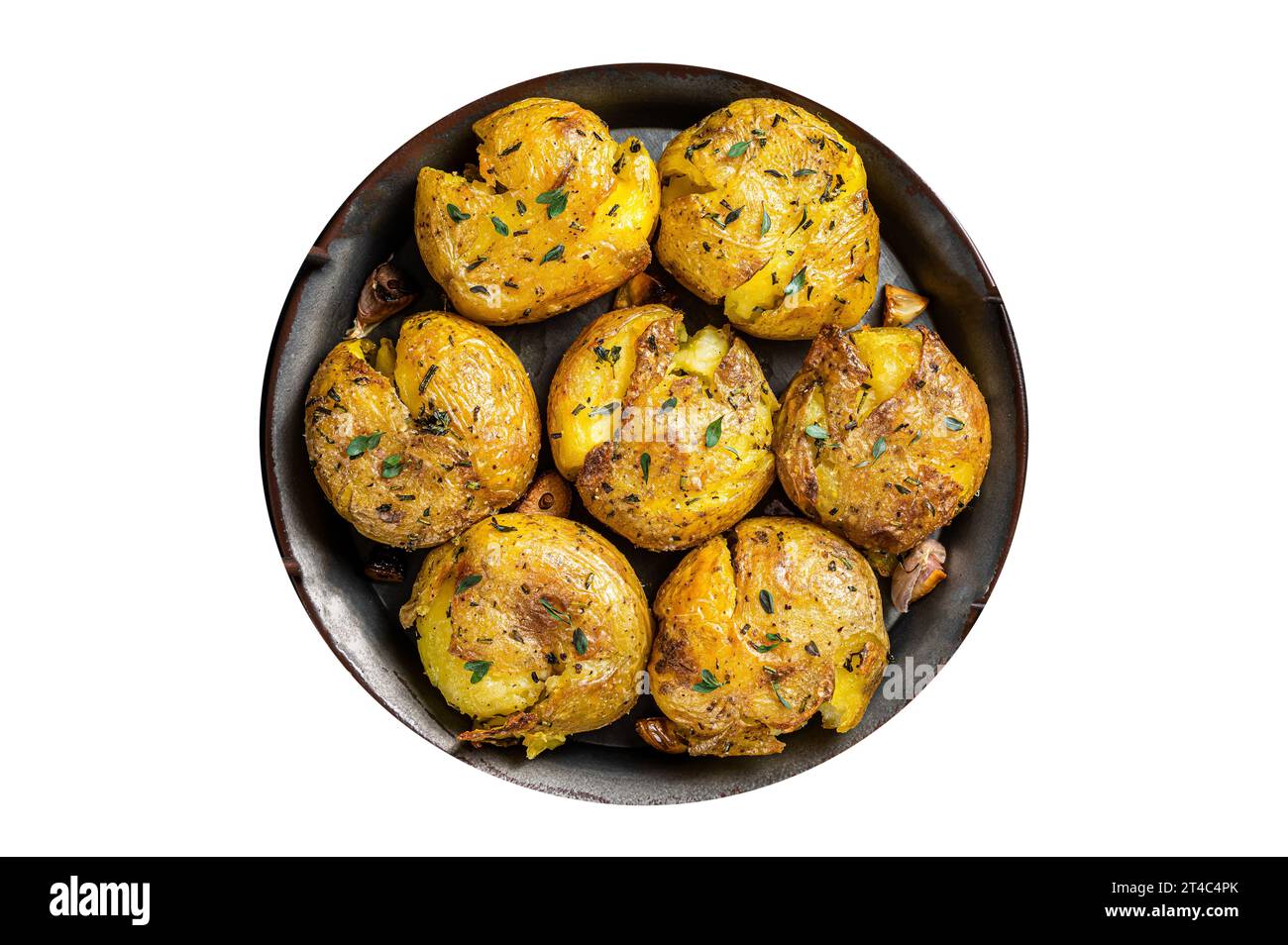 Broken potatoes baked in oil with herbs. Isolated on white background ...