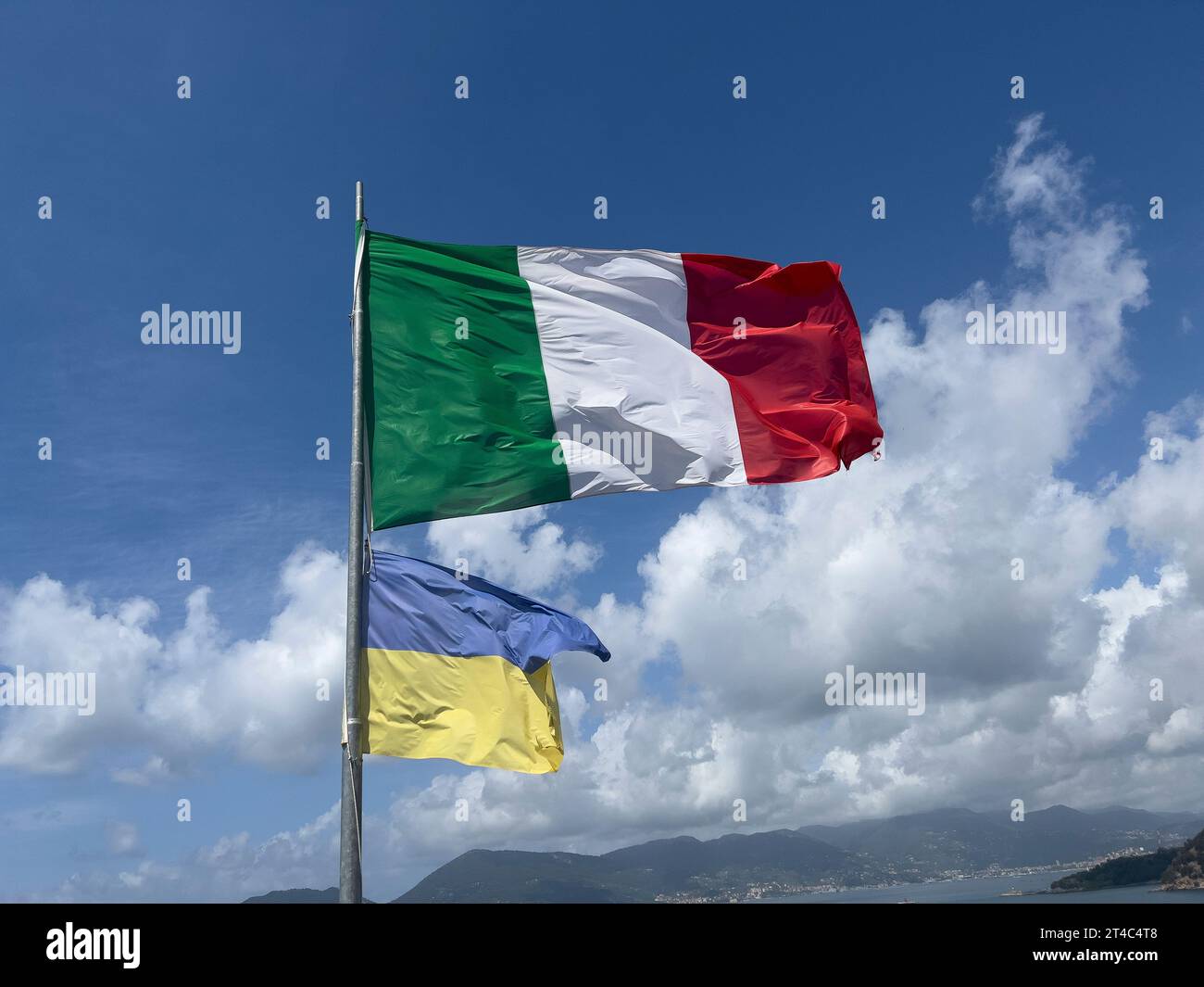 Italian flag waving on the flagpole of the castle of Lerici Italy. High ...