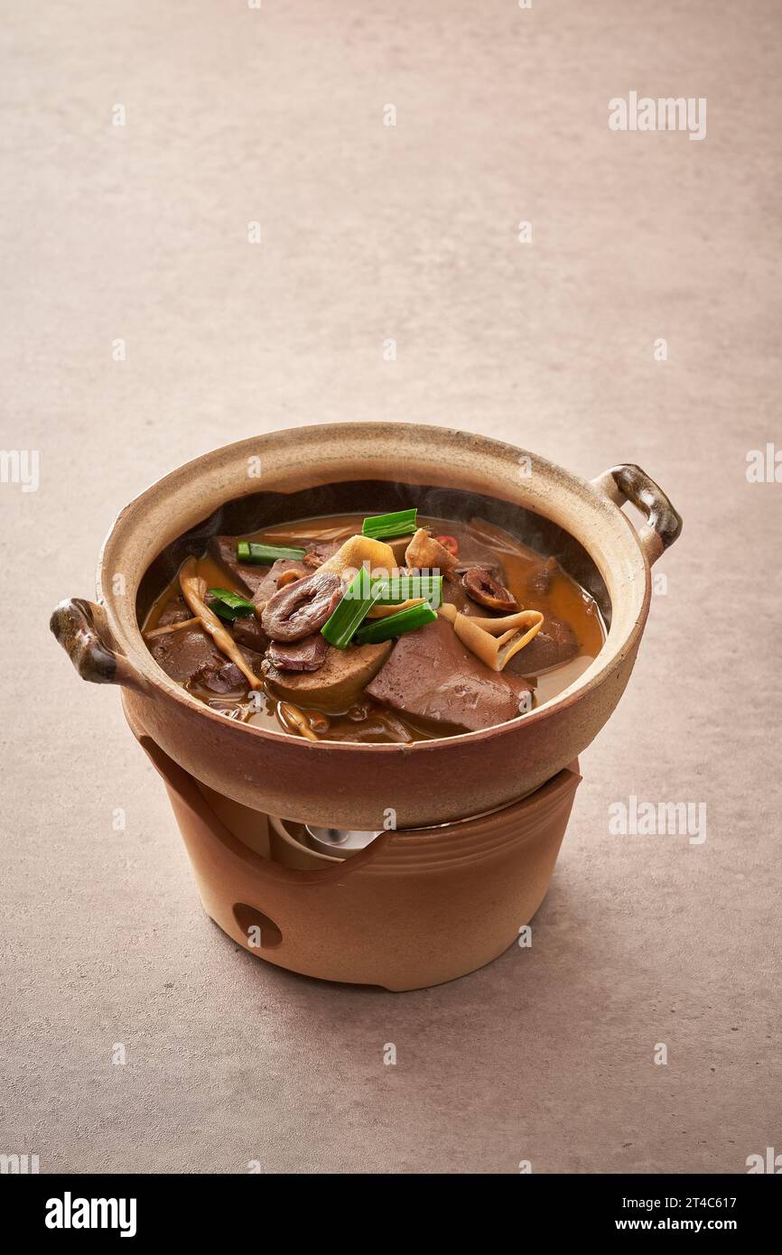 braised goose blood and goose offal in claypot Stock Photo - Alamy