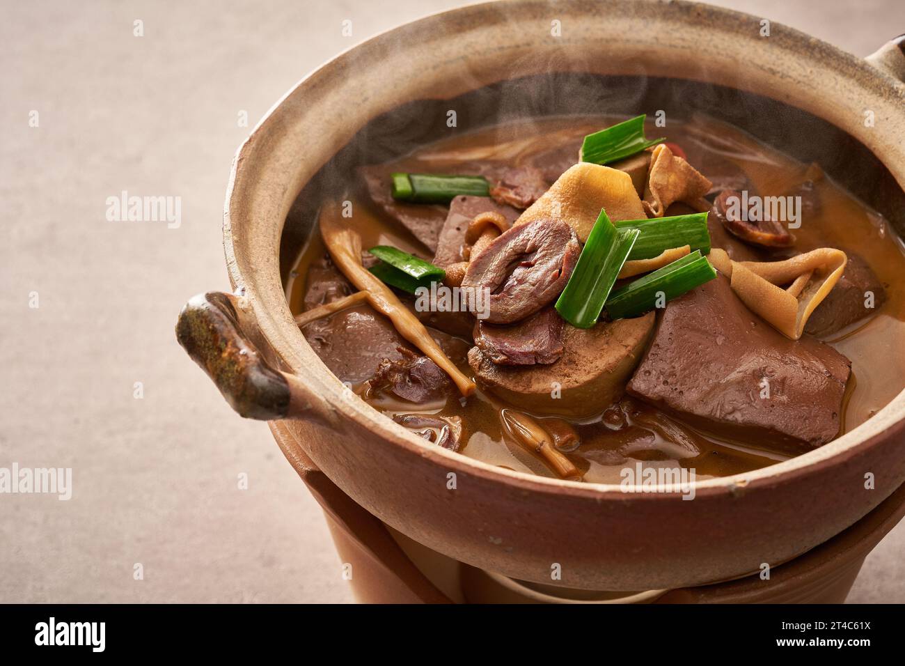 braised goose blood and goose offal in claypot Stock Photo - Alamy