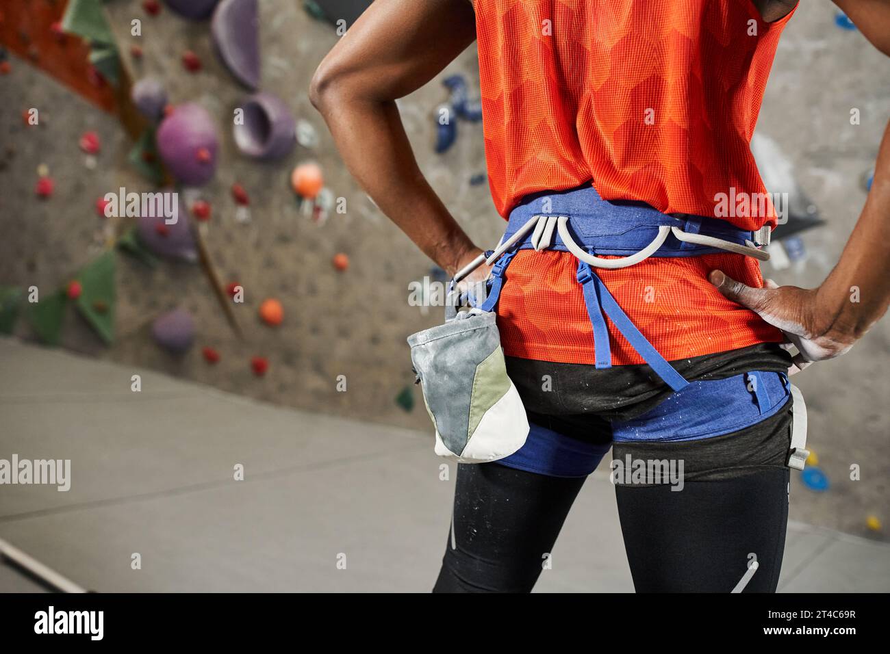 cropped view of african american man with alpine harness and his hands ...