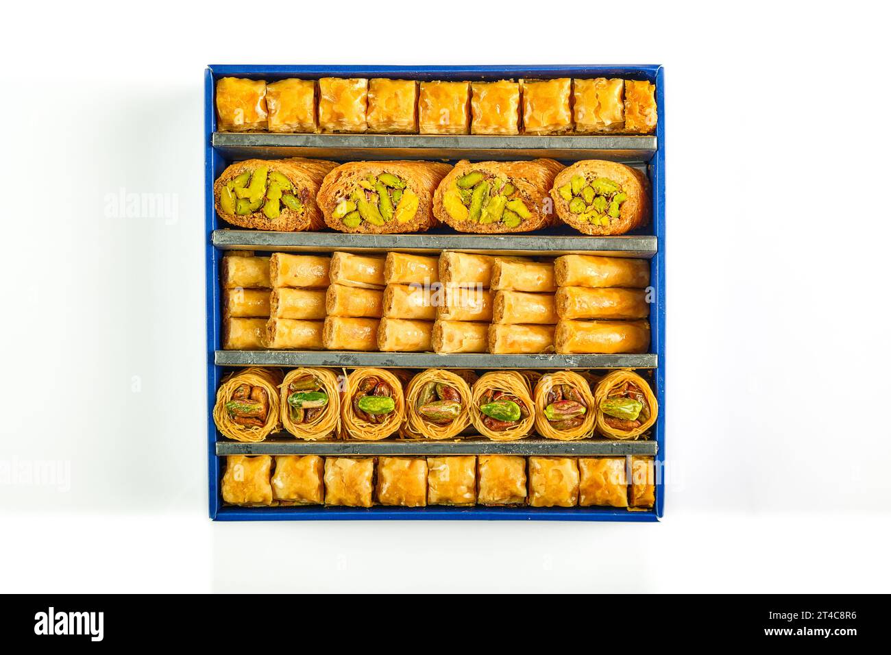 Arabic sweets boxes. Pictured from above showing several shapes and ...
