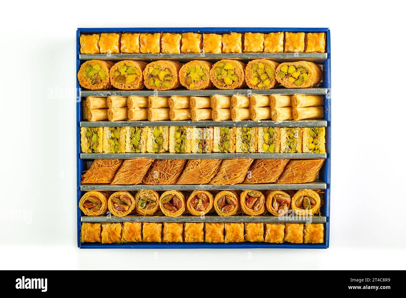 Arabic sweets boxes. Pictured from above showing several shapes and ...