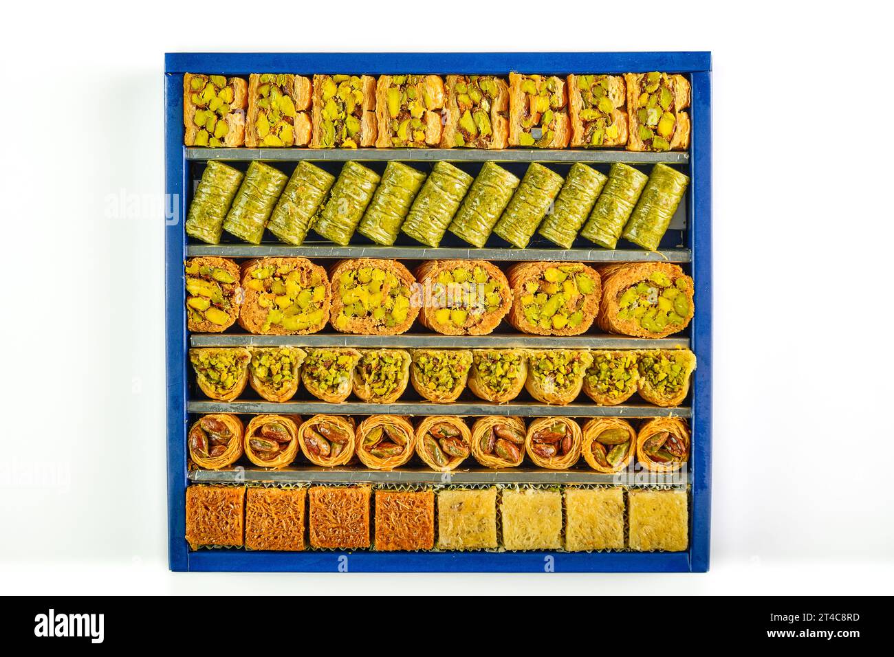 Arabic sweets boxes. Pictured from above showing several shapes and ...