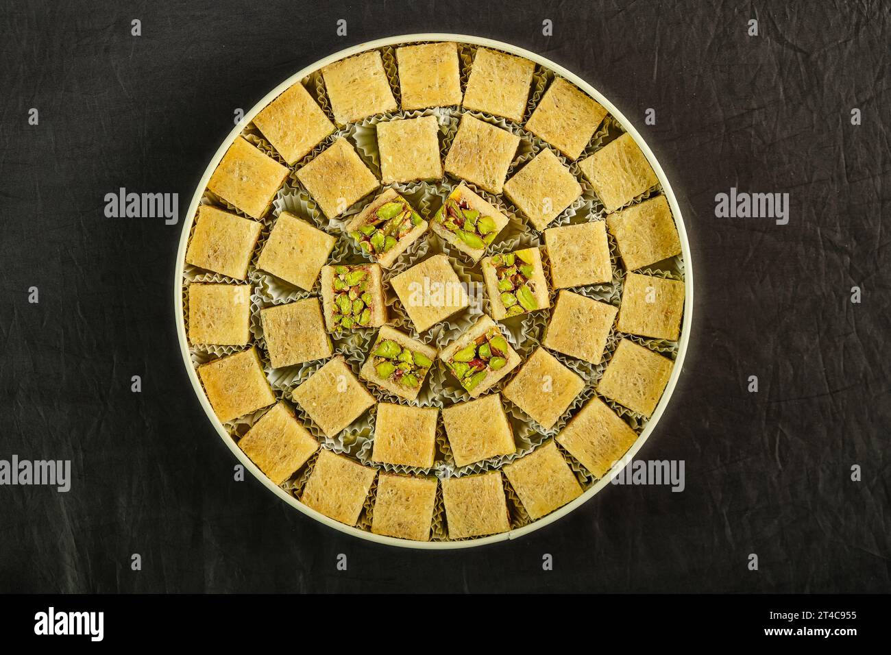 Arabic sweets boxes. Pictured from above showing several shapes and ...