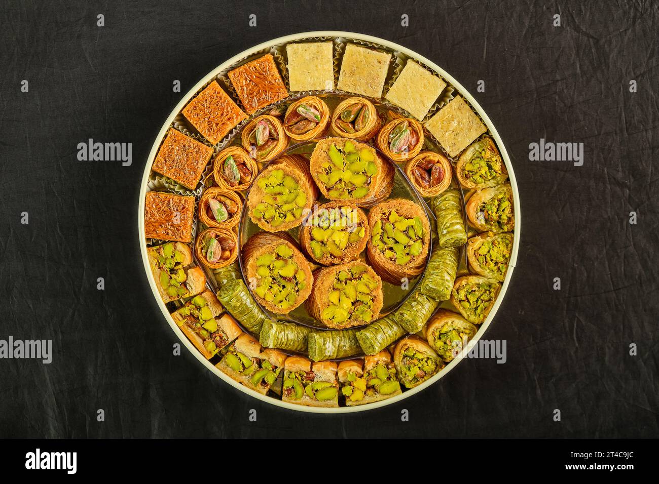 Arabic sweets boxes. Pictured from above showing several shapes and ...