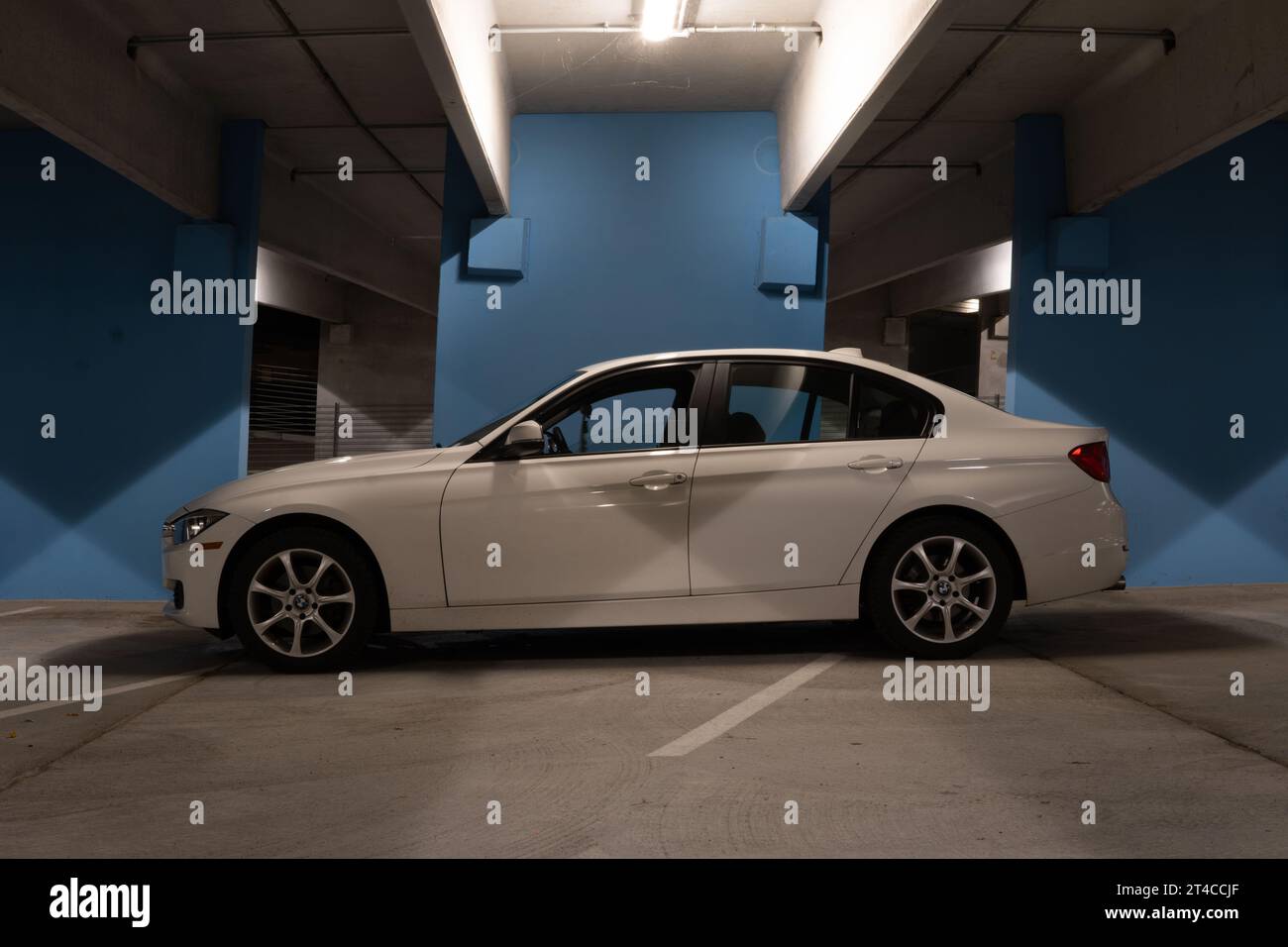 BMW 328i F30 side shot in a parking garage Stock Photo - Alamy