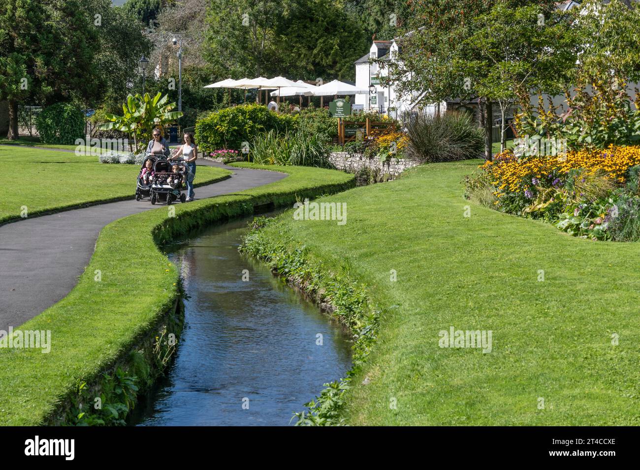A small stream river flowing through the landscaped Trenance Gardens in ...