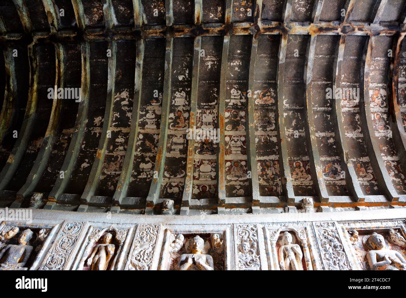 Cave No. 19. Vaulted ceiling showing stone rafters with painted Buddha ...