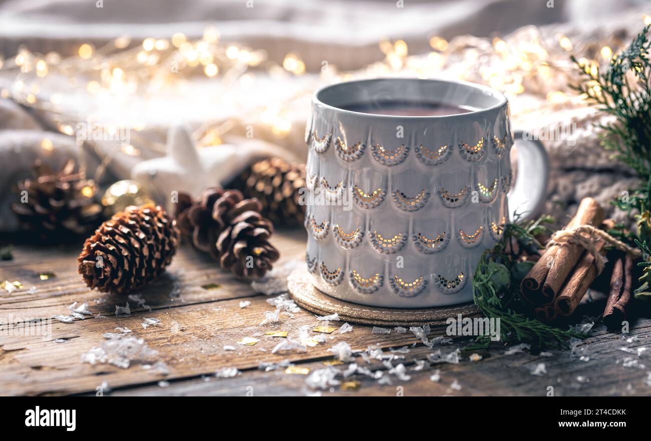 Coffee cup at home on a wooden table with bumps on a background with ...