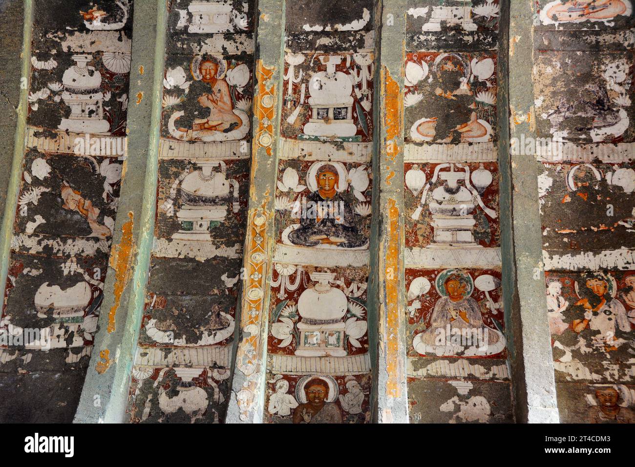 Cave No. 19. Painted Buddhas and votive stupa's between the stone ...