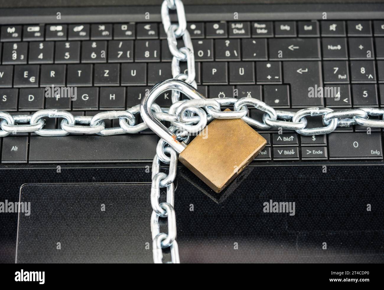 laptop keyboard with chain and safety lock, data safety Stock Photo - Alamy