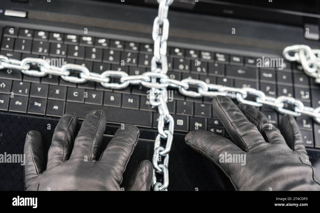 laptop keyboard with chain and safety lock, data safety Stock Photo - Alamy