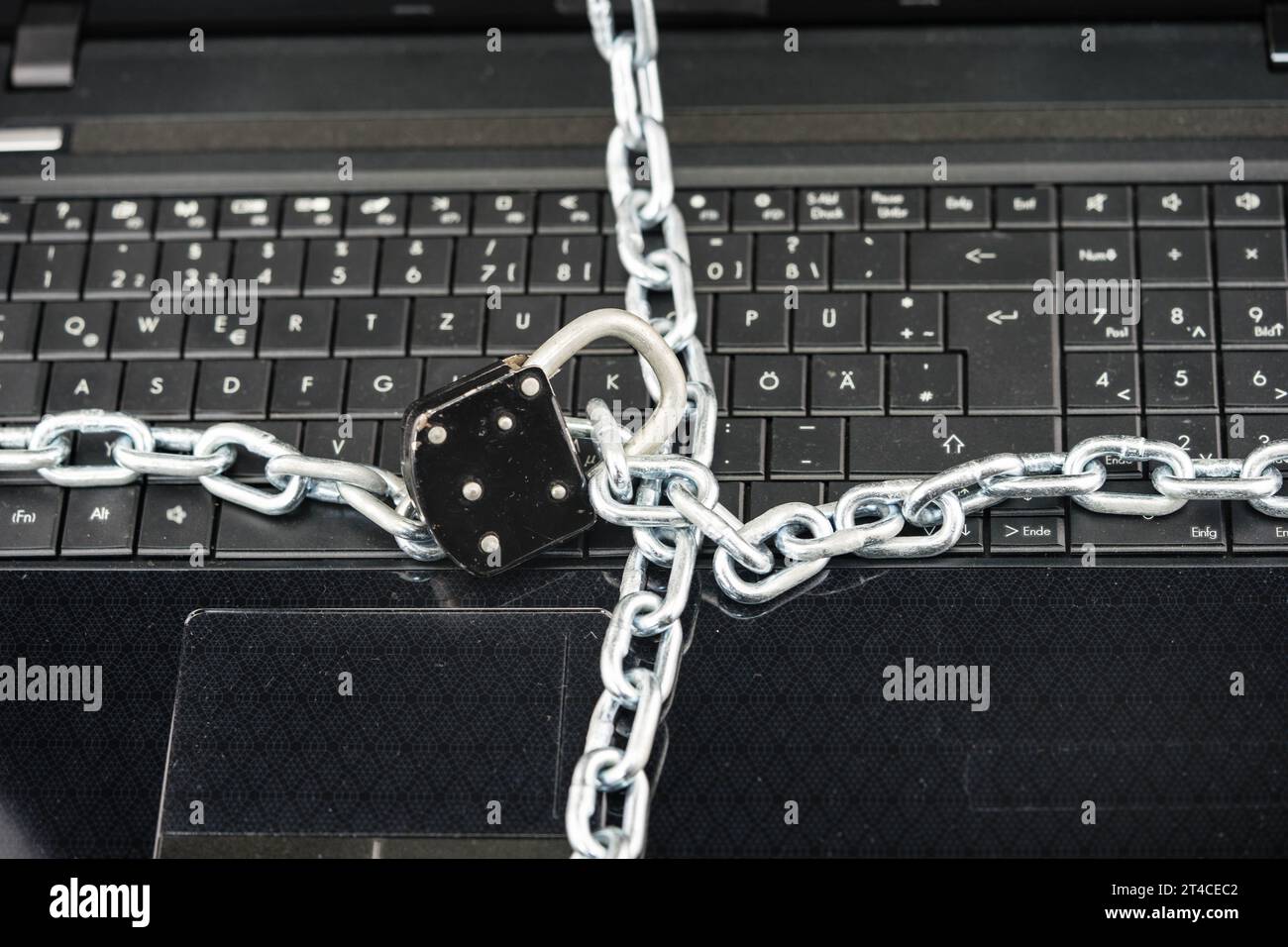 laptop keyboard with chain and safety lock, data safety Stock Photo - Alamy