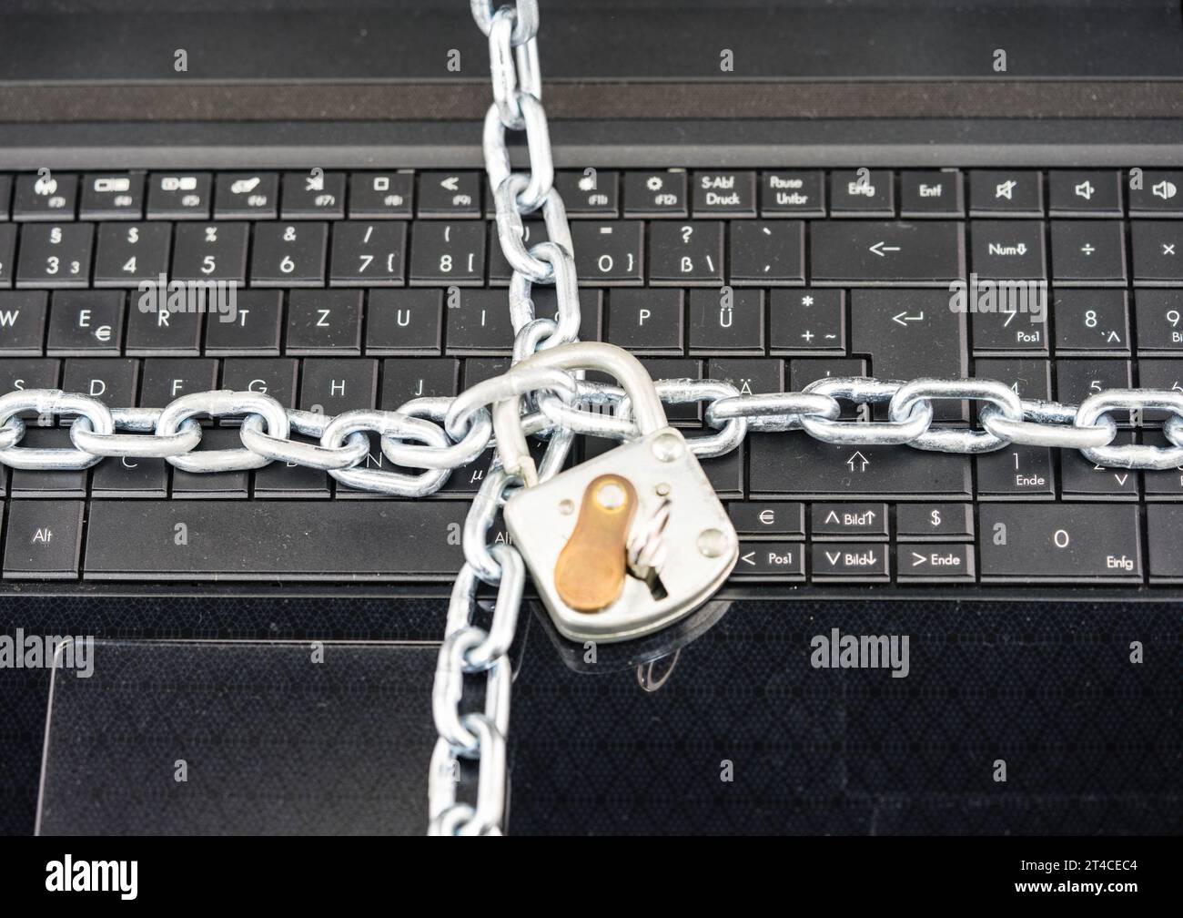laptop keyboard with chain and safety lock, data safety Stock Photo - Alamy