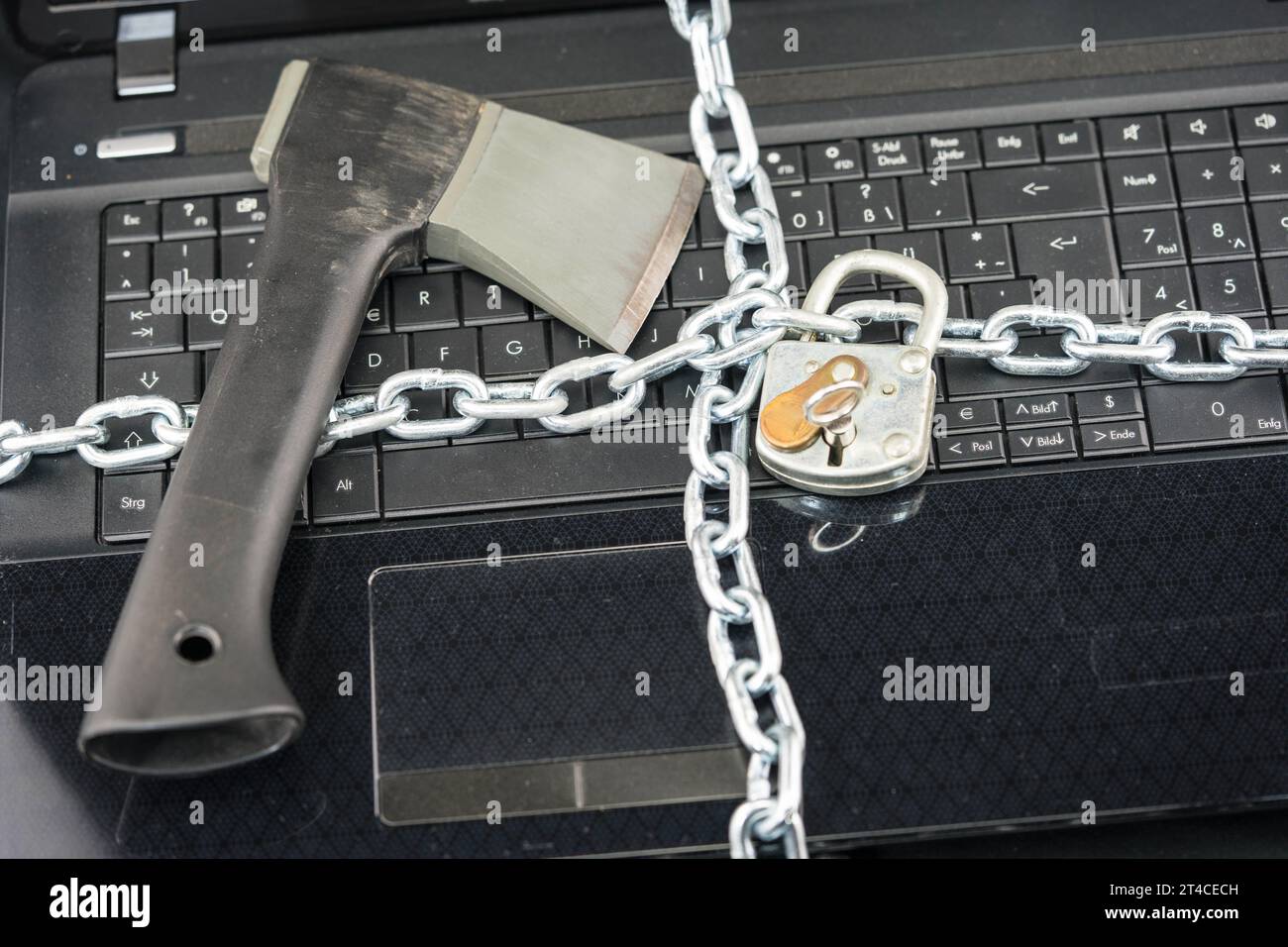 laptop keyboard with chain, safety lock and Ax, data safety Stock Photo ...
