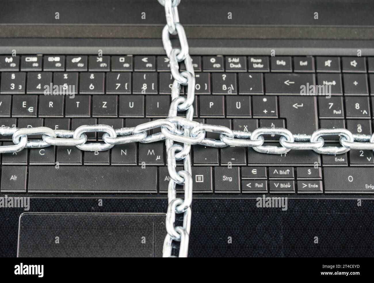 laptop keyboard with chain, data safety Stock Photo - Alamy