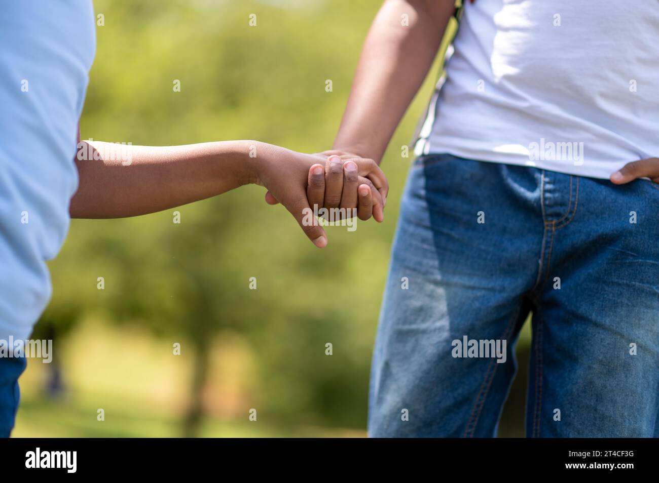 Close up picture of a two young people walking hand in hand Stock Photo ...