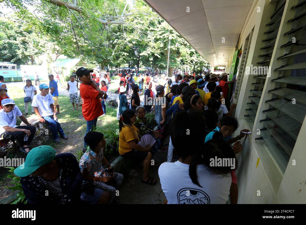 Quezon, Philippines. 30th Oct, 2023. Voters lineup outside the poling ...