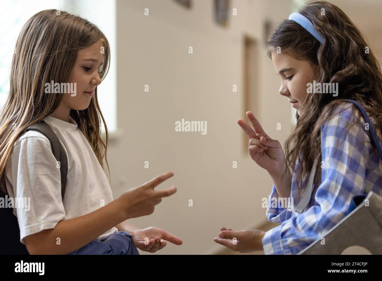Kids playing finger game at break at school Stock Photo - Alamy