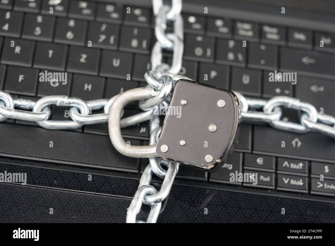 laptop keyboard with chain and safety lock, data safety Stock Photo - Alamy