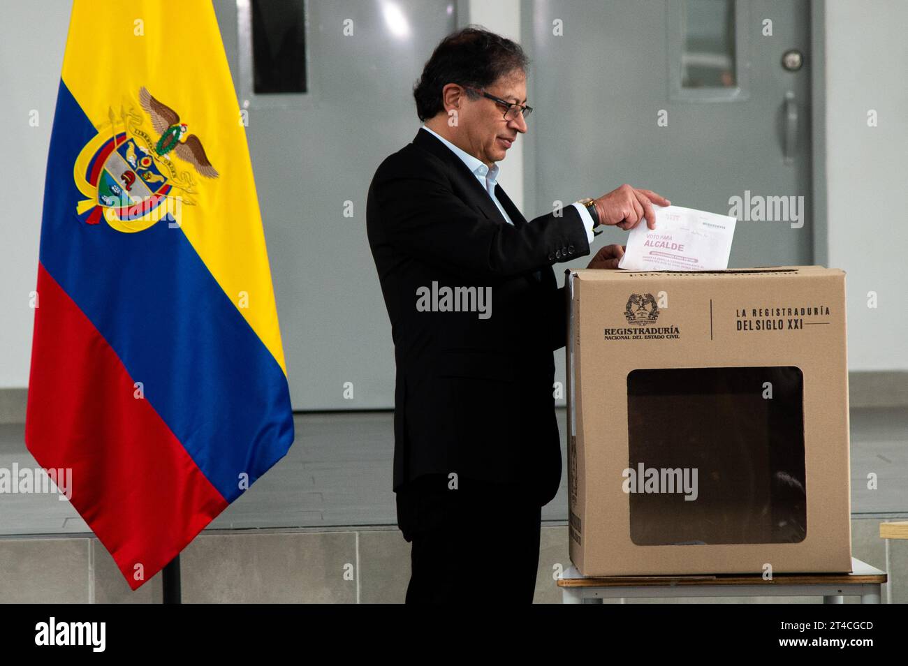 President Gustavo Petro casts his vote during the Colombian regional elections in Bogota ...
