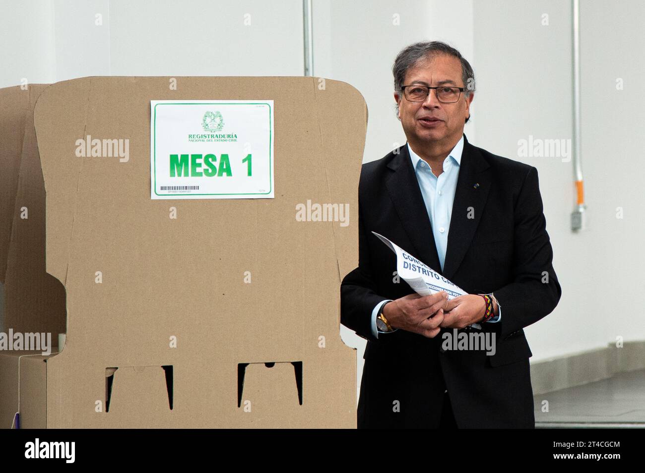 President Gustavo Petro casts his vote during the Colombian regional elections in Bogota ...
