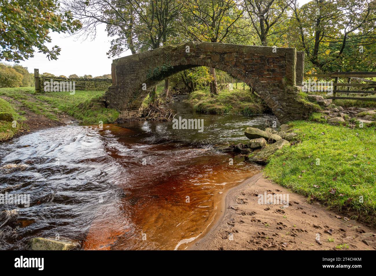 Haworth, October 25th 2023: Small bridge over a stream outside Haworth ...