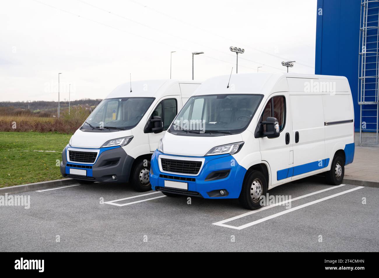 Vans are parked in row. Commercial fleet Stock Photo - Alamy