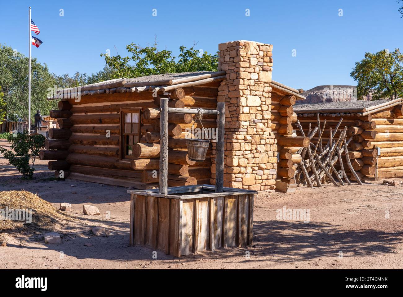 A water well and pioneer log cabins at the Bluff Fort Historic Site in ...