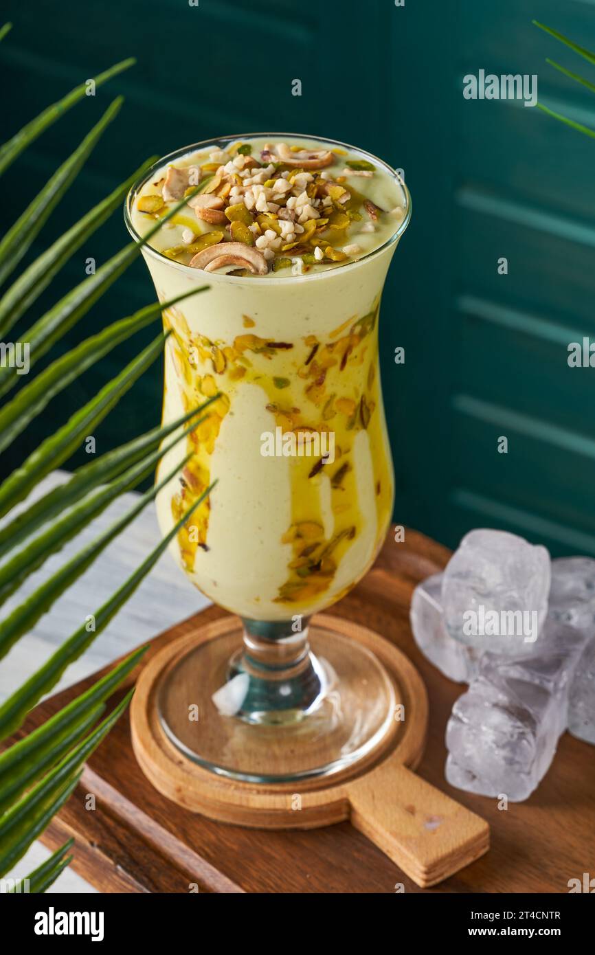 Avocado juice with nuts and honey Stock Photo - Alamy