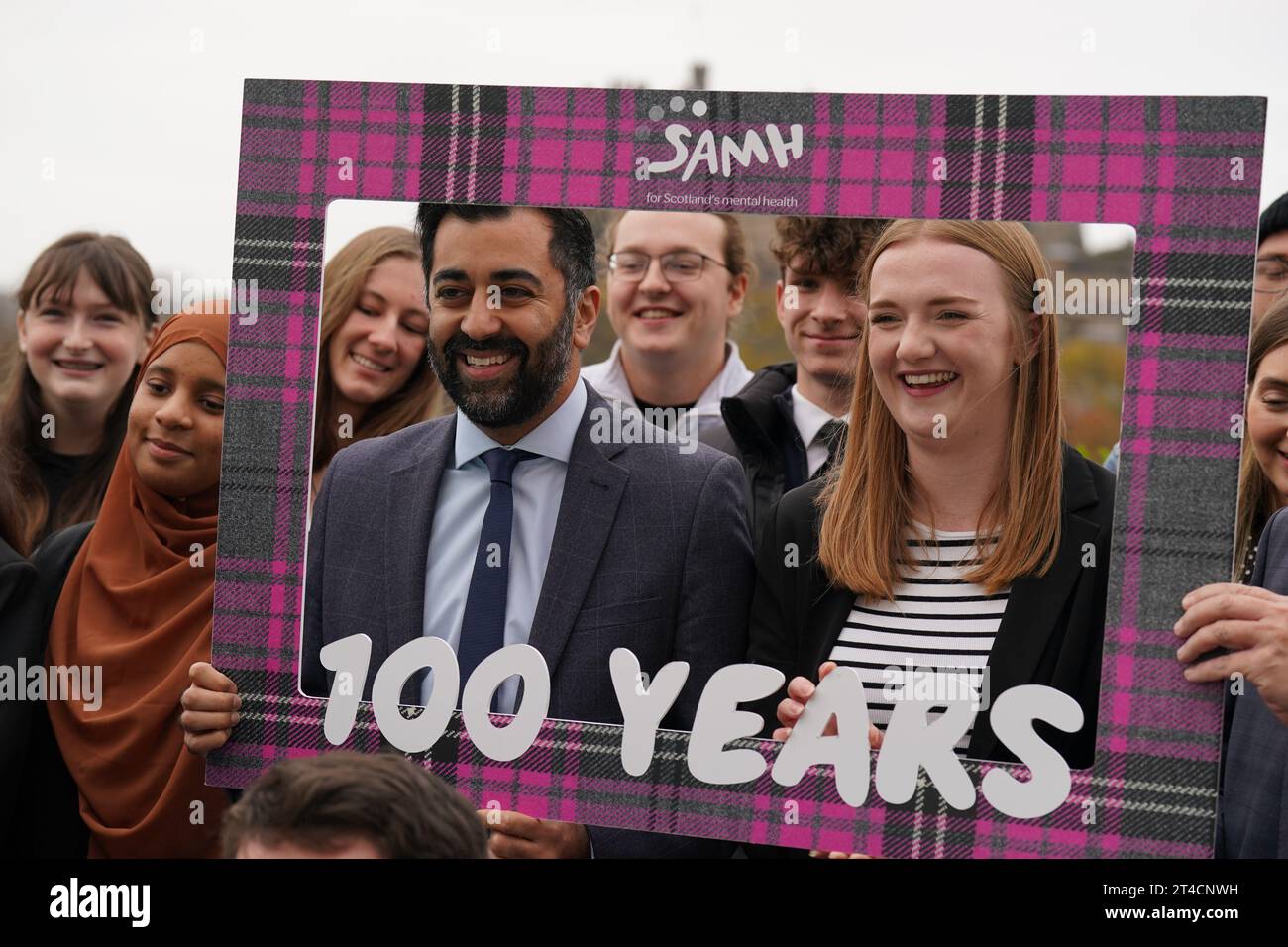 Scottish First Minister Humza Yousaf (centre) with Isla Buchanan (right ...