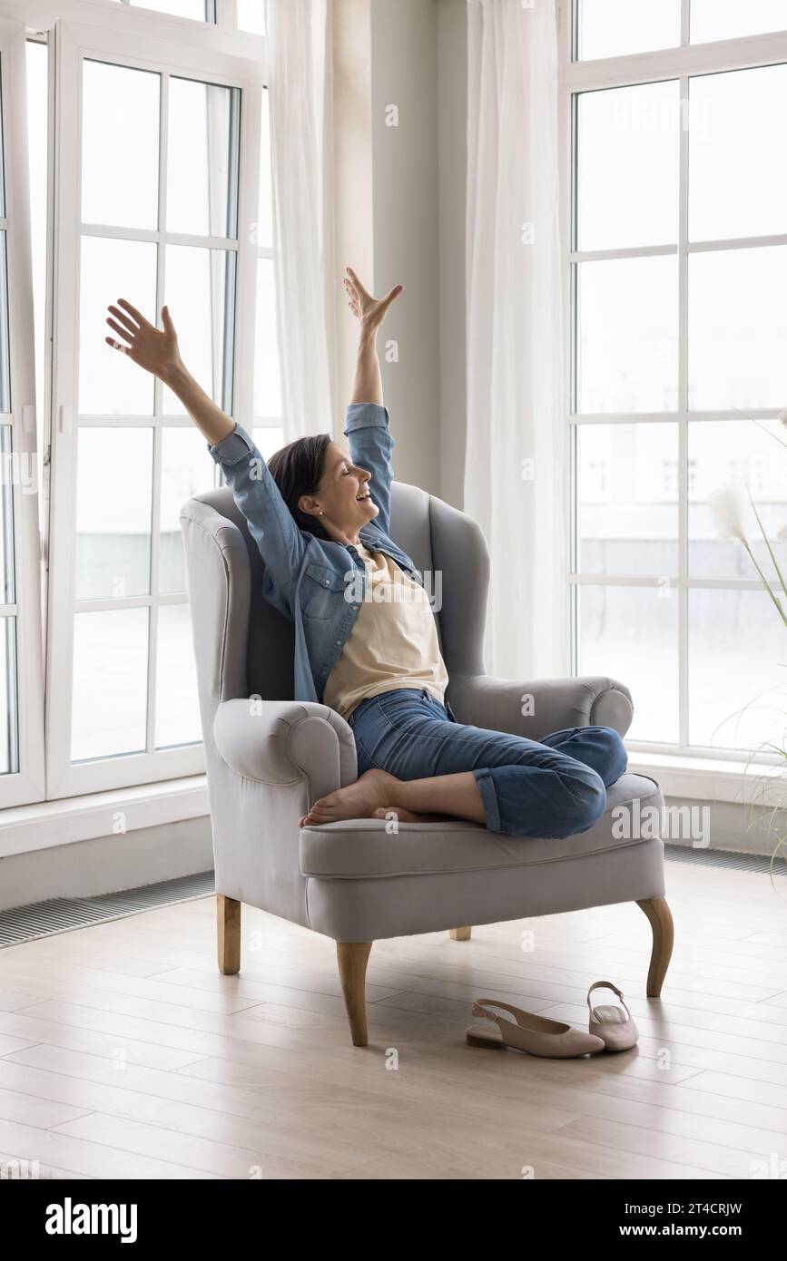 Happy woman raised her arms do stretching exercises feel rested Stock ...