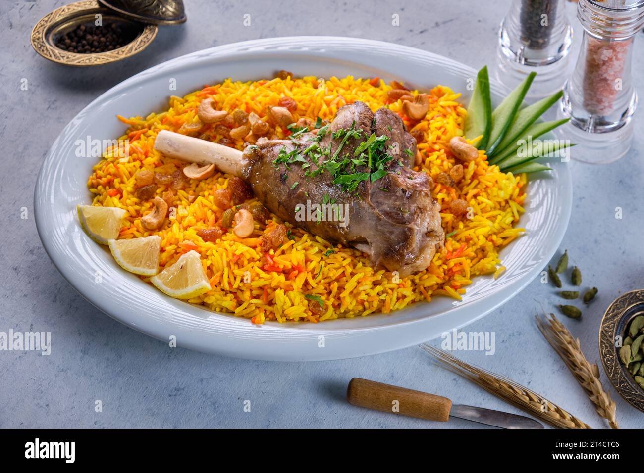 A plate of mandi rice with grilled lamb Stock Photo - Alamy