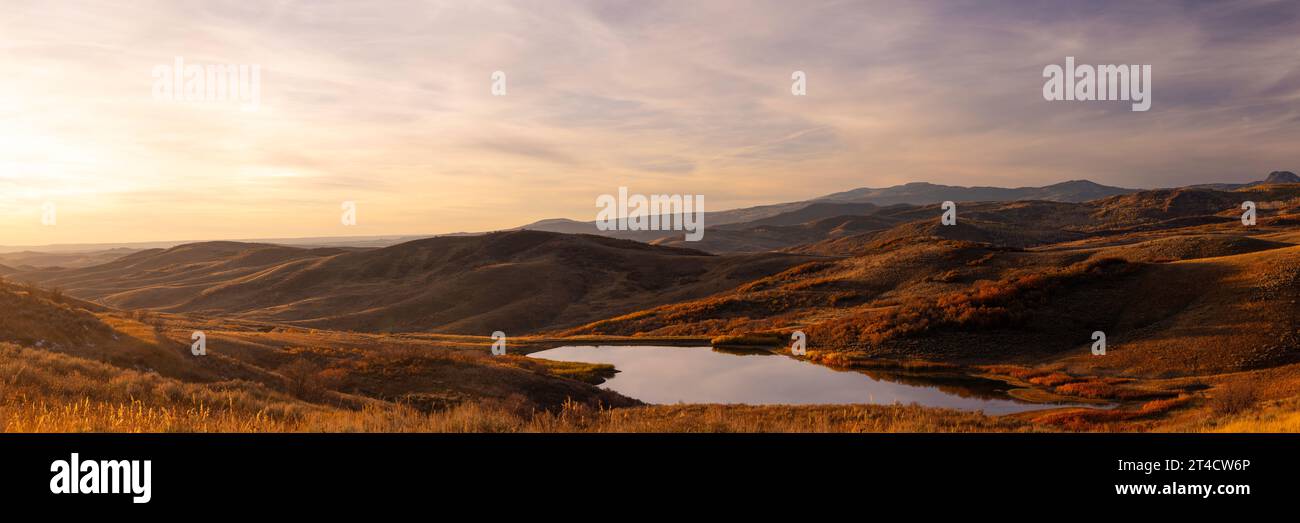 A few minutes before sunset on some rugged backcountry foothills north ...