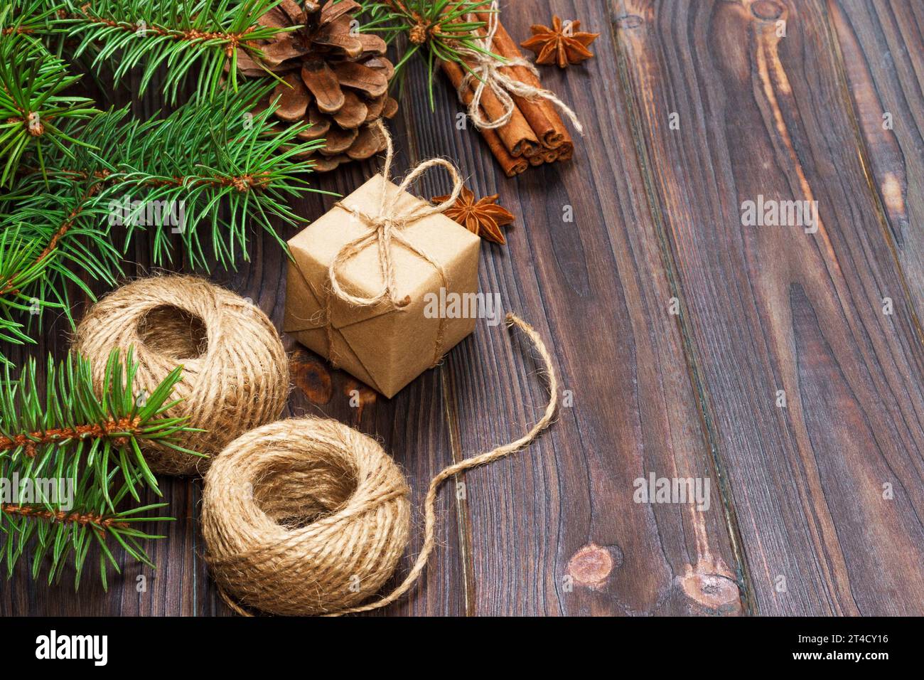 christmas present box and fir branches with cinnamon and anise on ...