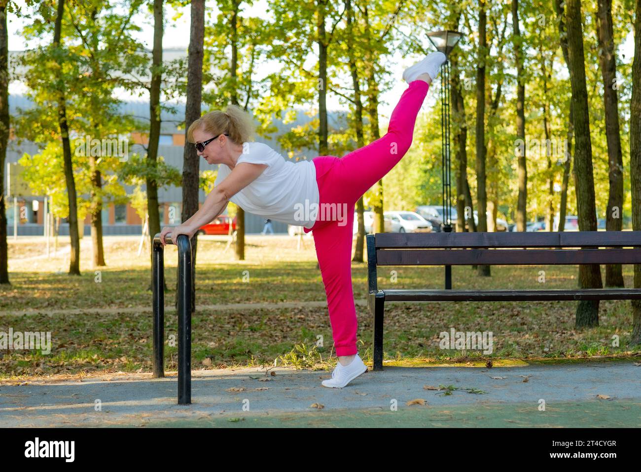 A woman doing gymnastics outdoors Stock Photo - Alamy