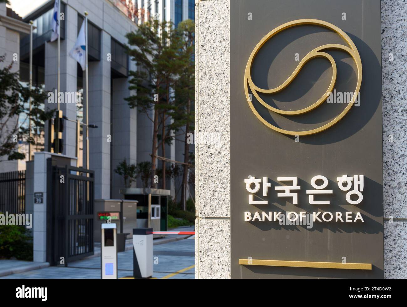 The Bank of Korea (BOK) nameplate is located at the entrance to the ...