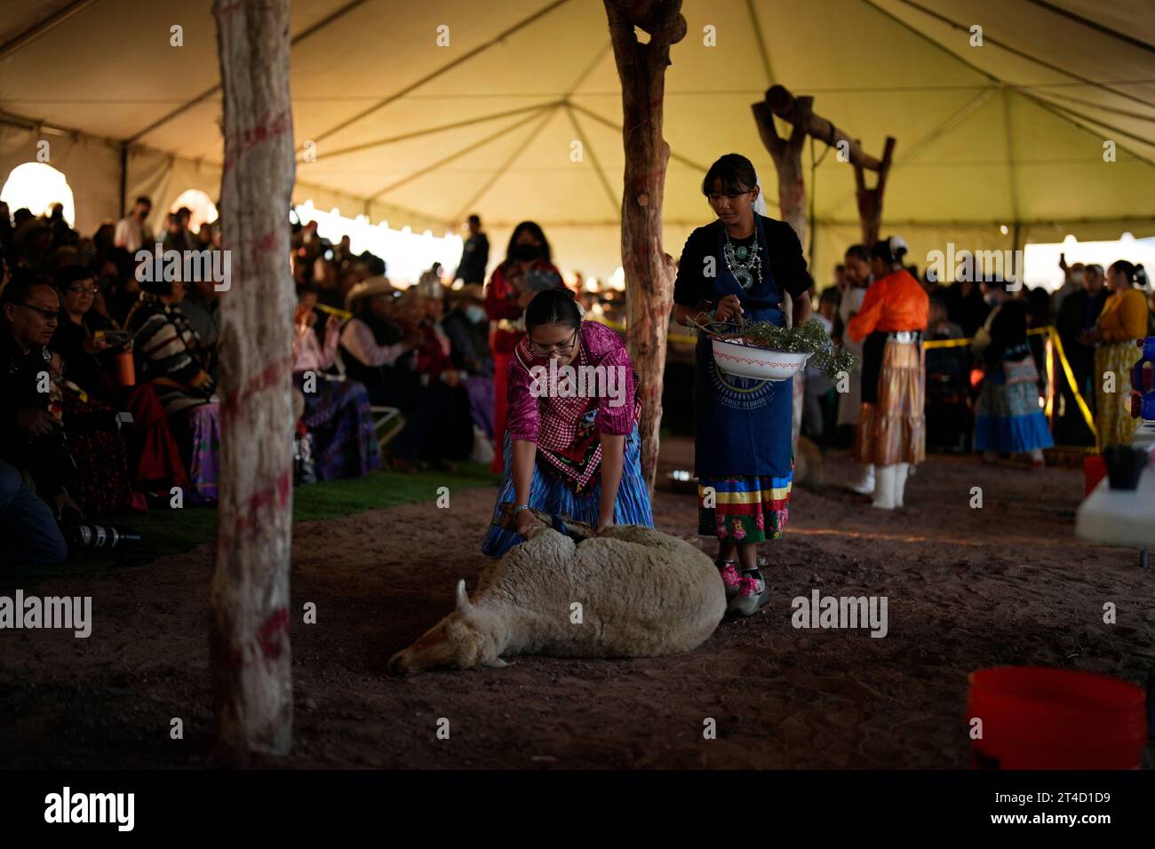 Miss Navajo Nation pageant contestant Amy Begaye, left, prepares a ...