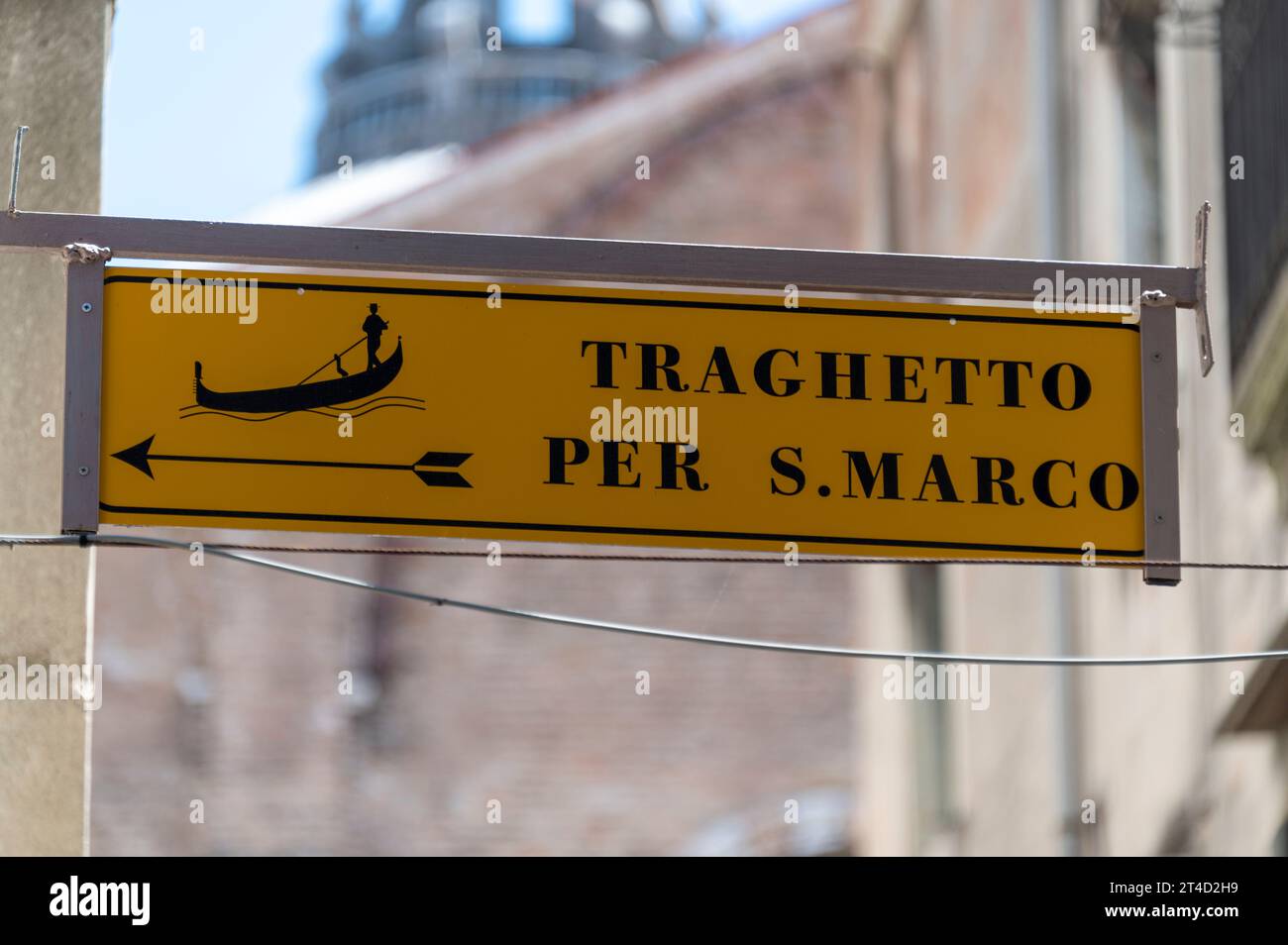 A Venetian street sign with a picture of a gondola service - Traghetto ...