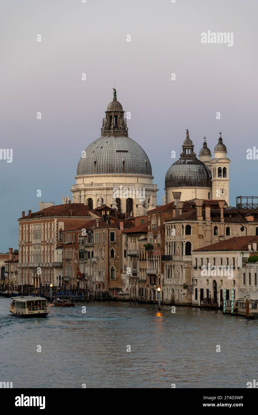 At dusk on the Grand Canal lined with Renaissance buildings and the ...